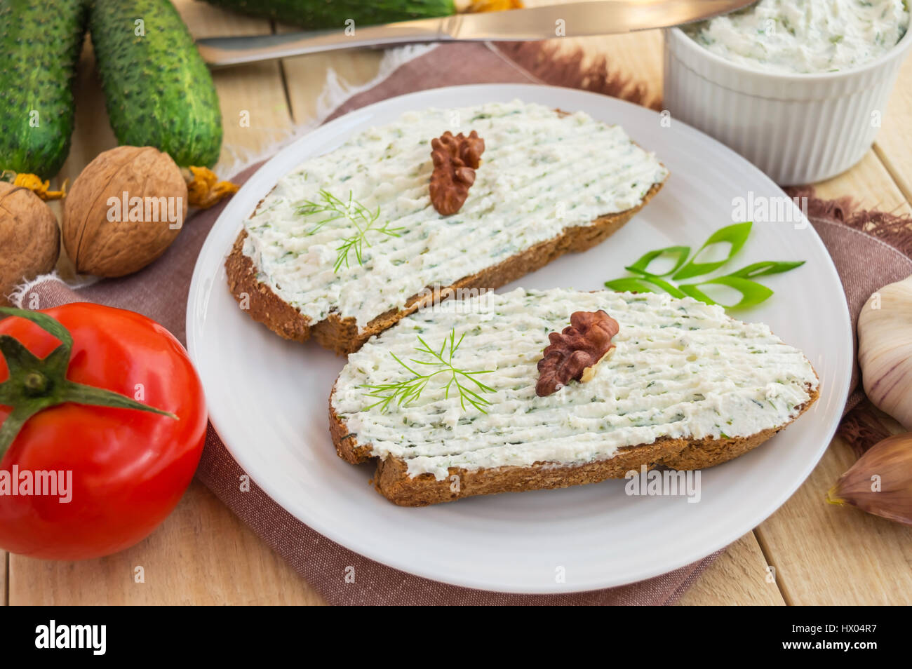 Nutritious sandwich with cottage cheese paste on rye bread on a white ...