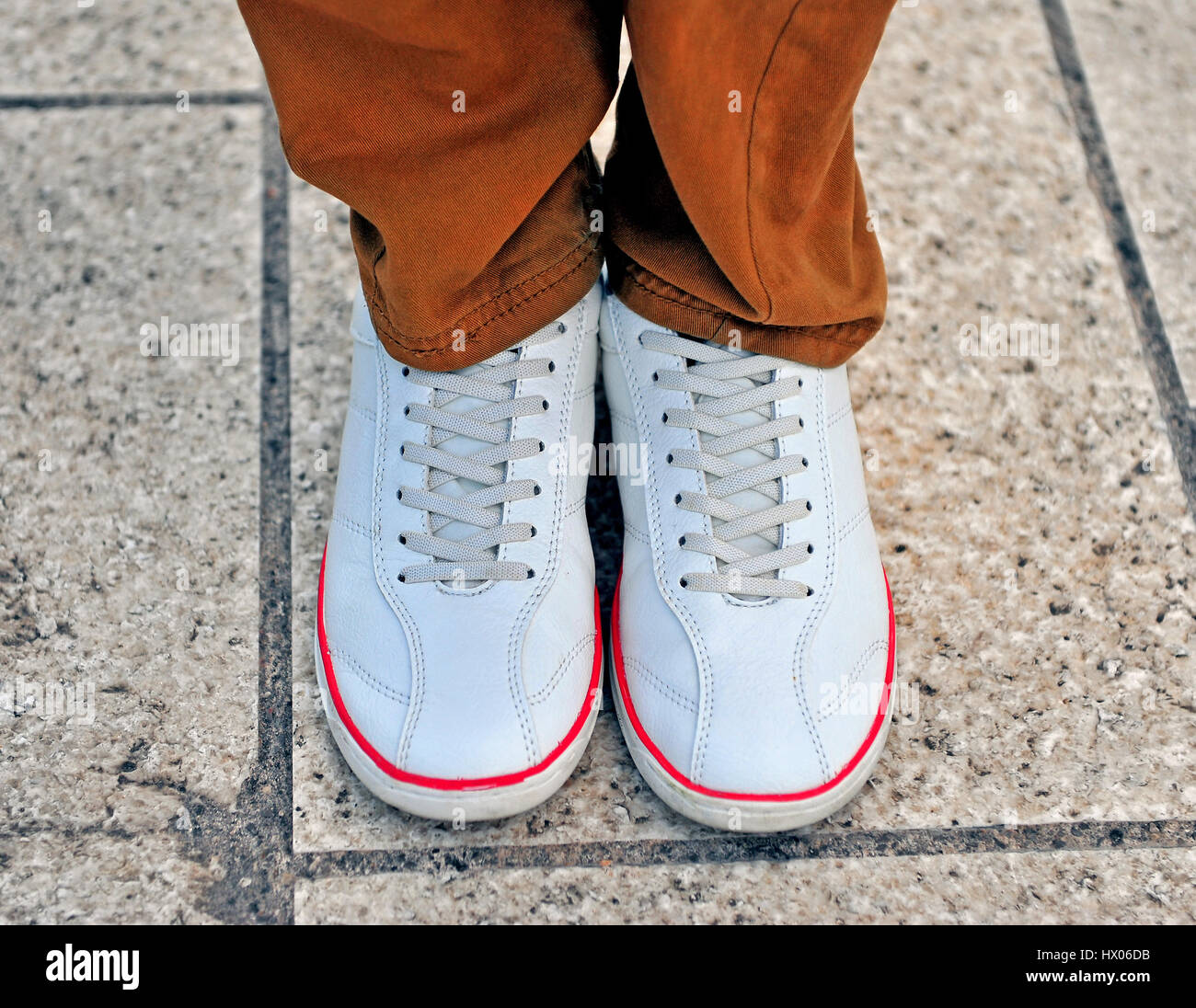 Top view of child's white casual shoes and trousers Stock Photo - Alamy