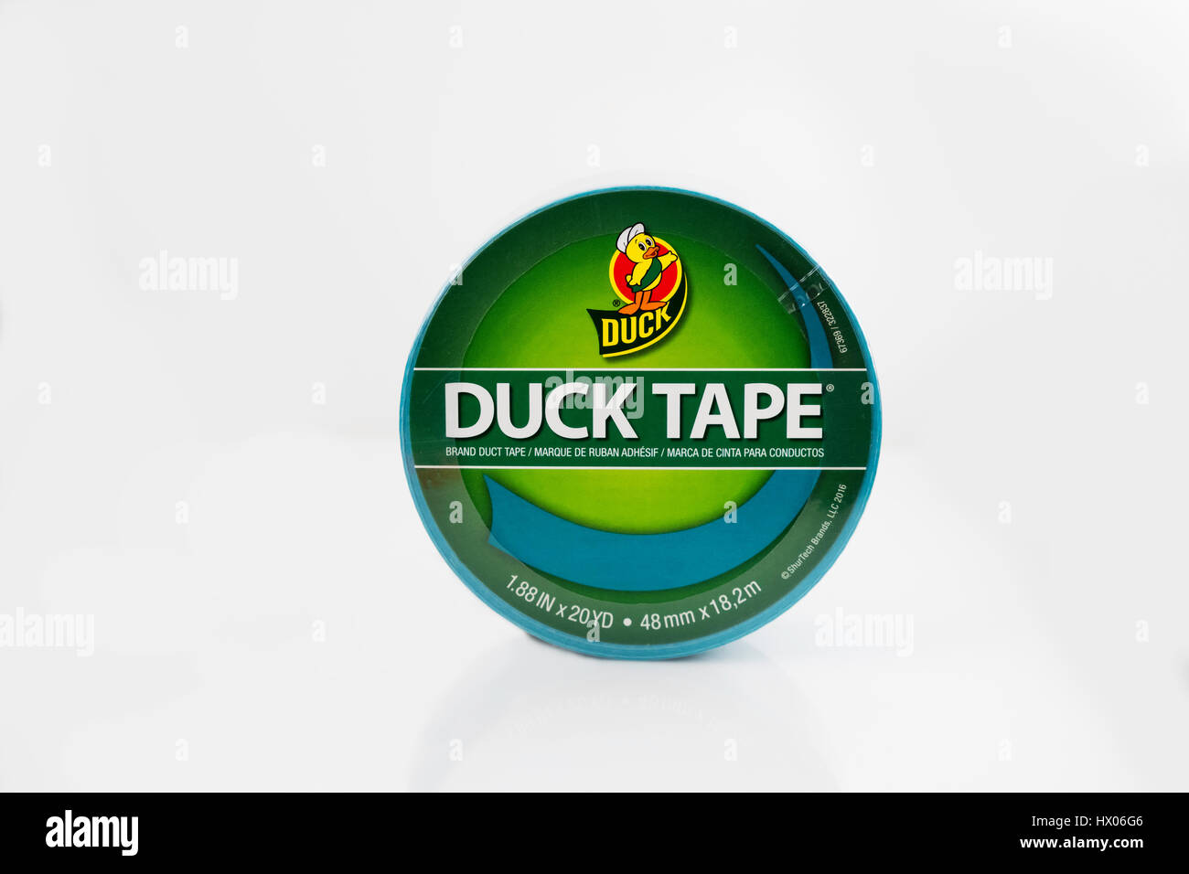 A roll of colored blue Duck Tape in package, white background. Cutout ...
