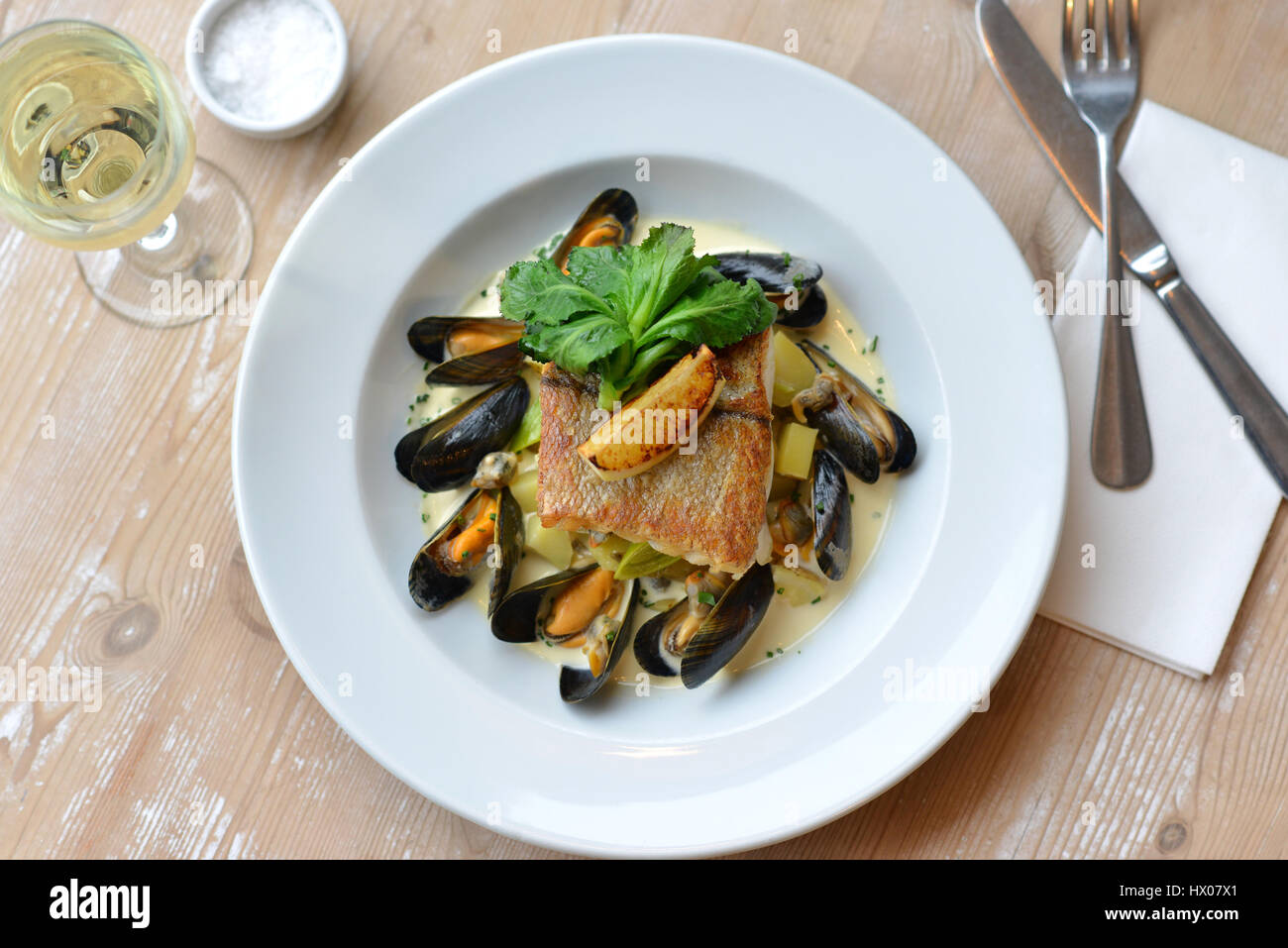 Plate of fried haddock and mussels Stock Photo - Alamy