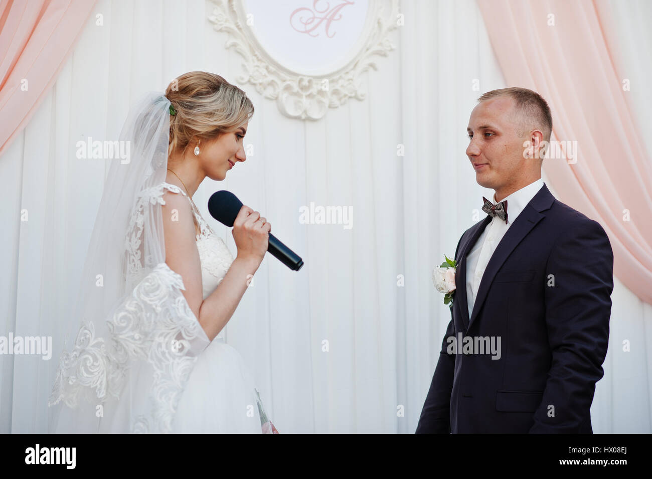 Bride speech, talking with microphone for her groom at wedding ceremony ...