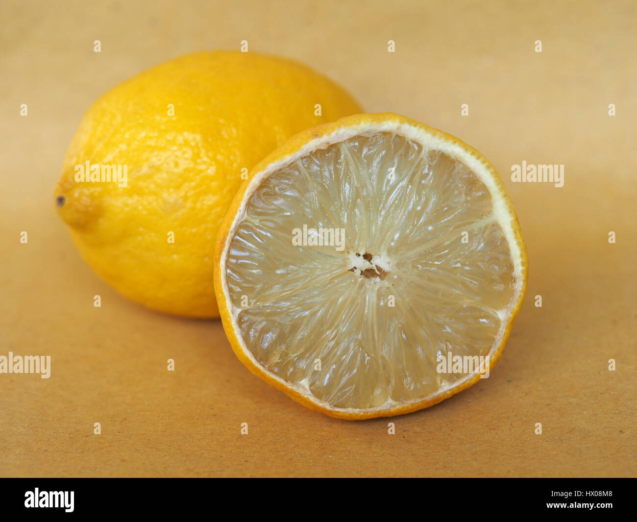 yellow lemon (Citrus x limon) whole fruit and sliced Stock Photo - Alamy
