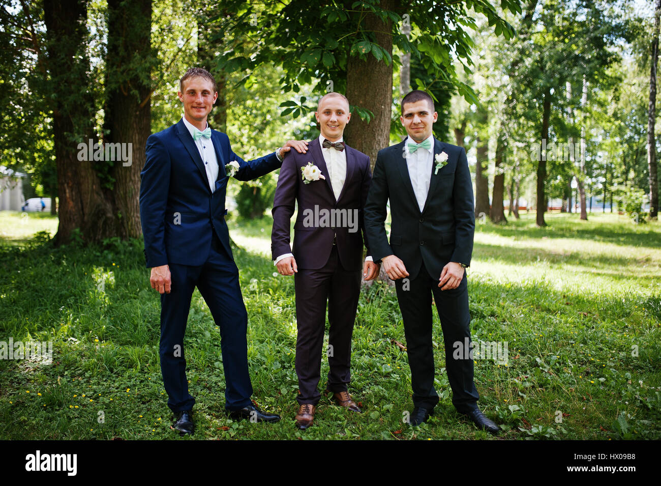 Groom with his best man's on wedding at park Stock Photo - Alamy