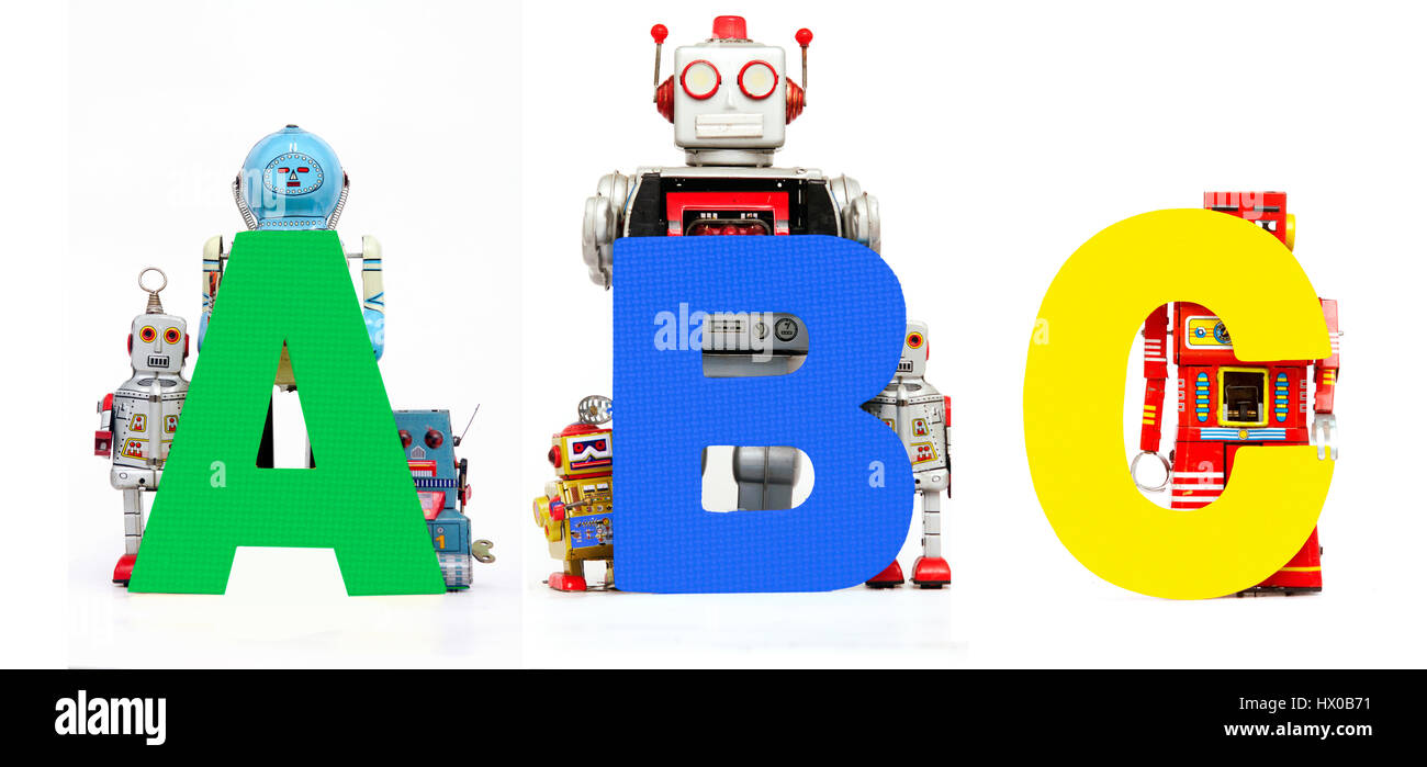 ABC robots holding up letters Stock Photo - Alamy