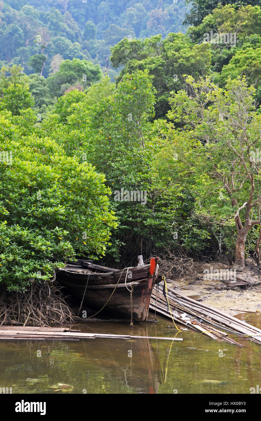 Old boat in the tidal esturay beside the village of Makyone Galet ...