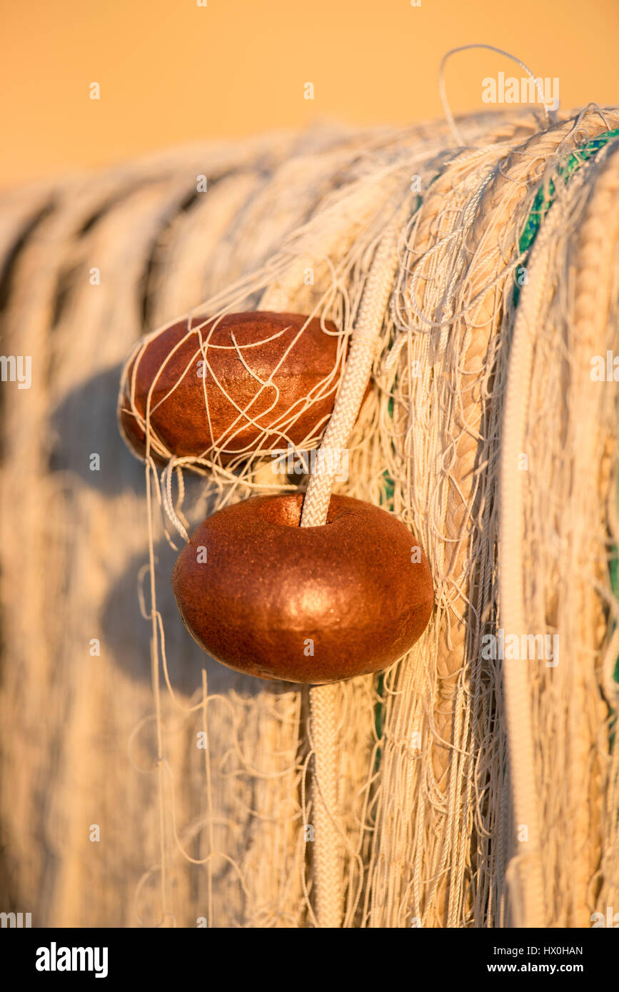 Fishing net and its orange floating devices Stock Photo - Alamy