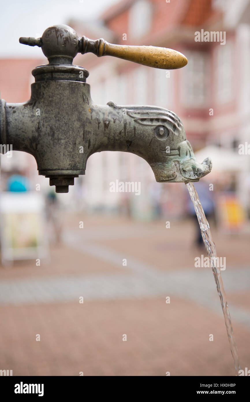 old fashioned metal tap running Stock Photo - Alamy