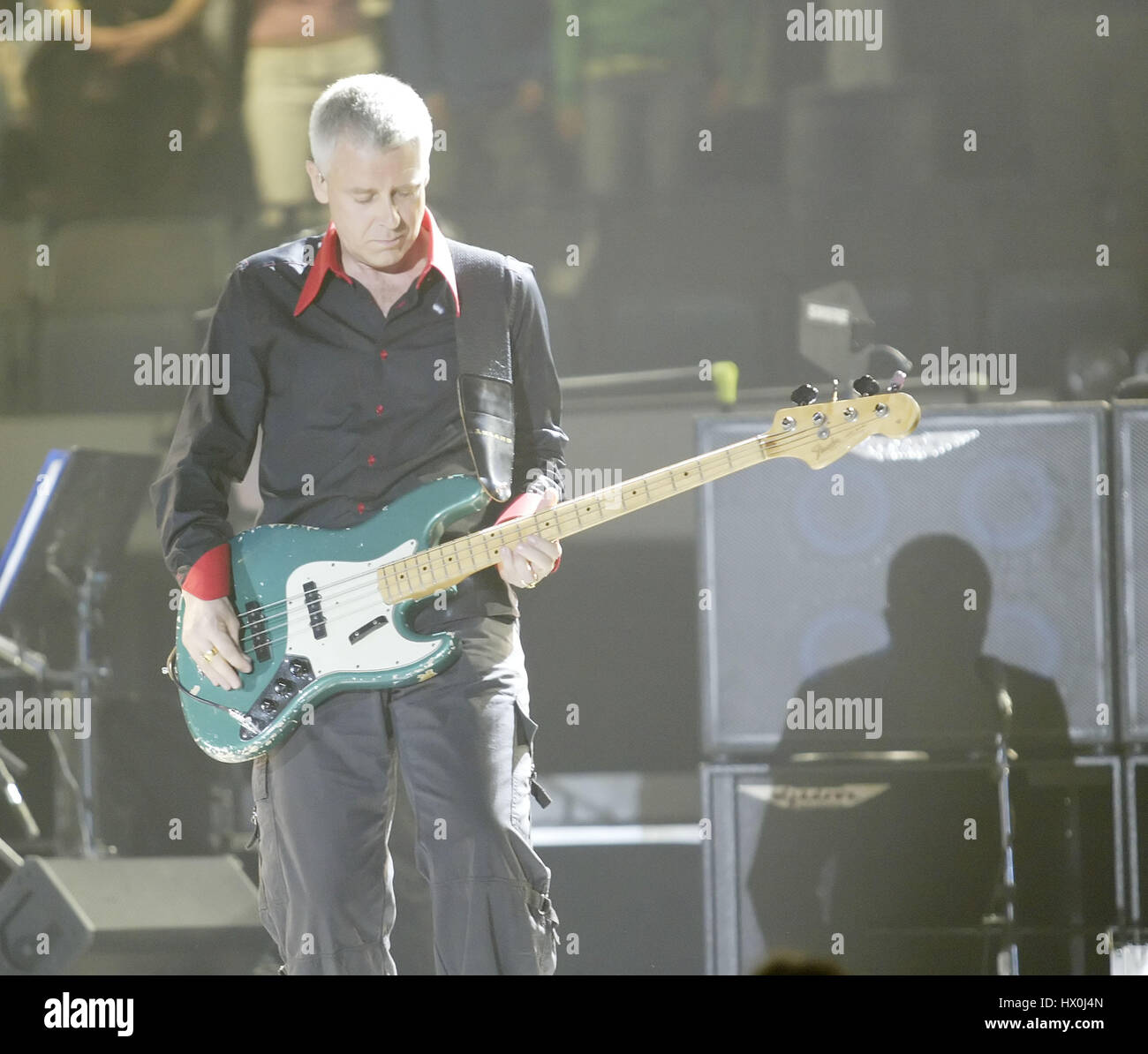 Bass player Adam Clayton of U2 in concert in San Diego, CA on March 28 ...