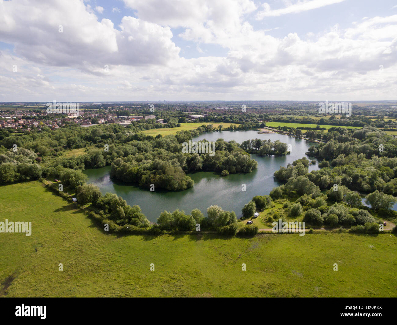 Aerial view over a lake in the summertime in the UK Stock Photo - Alamy