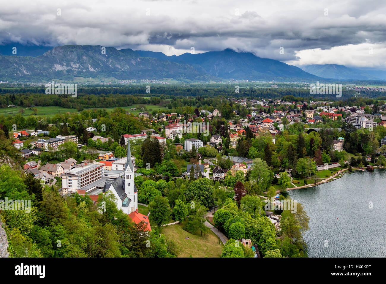 Aerial view of Bled city with Alps mountains in the background ...