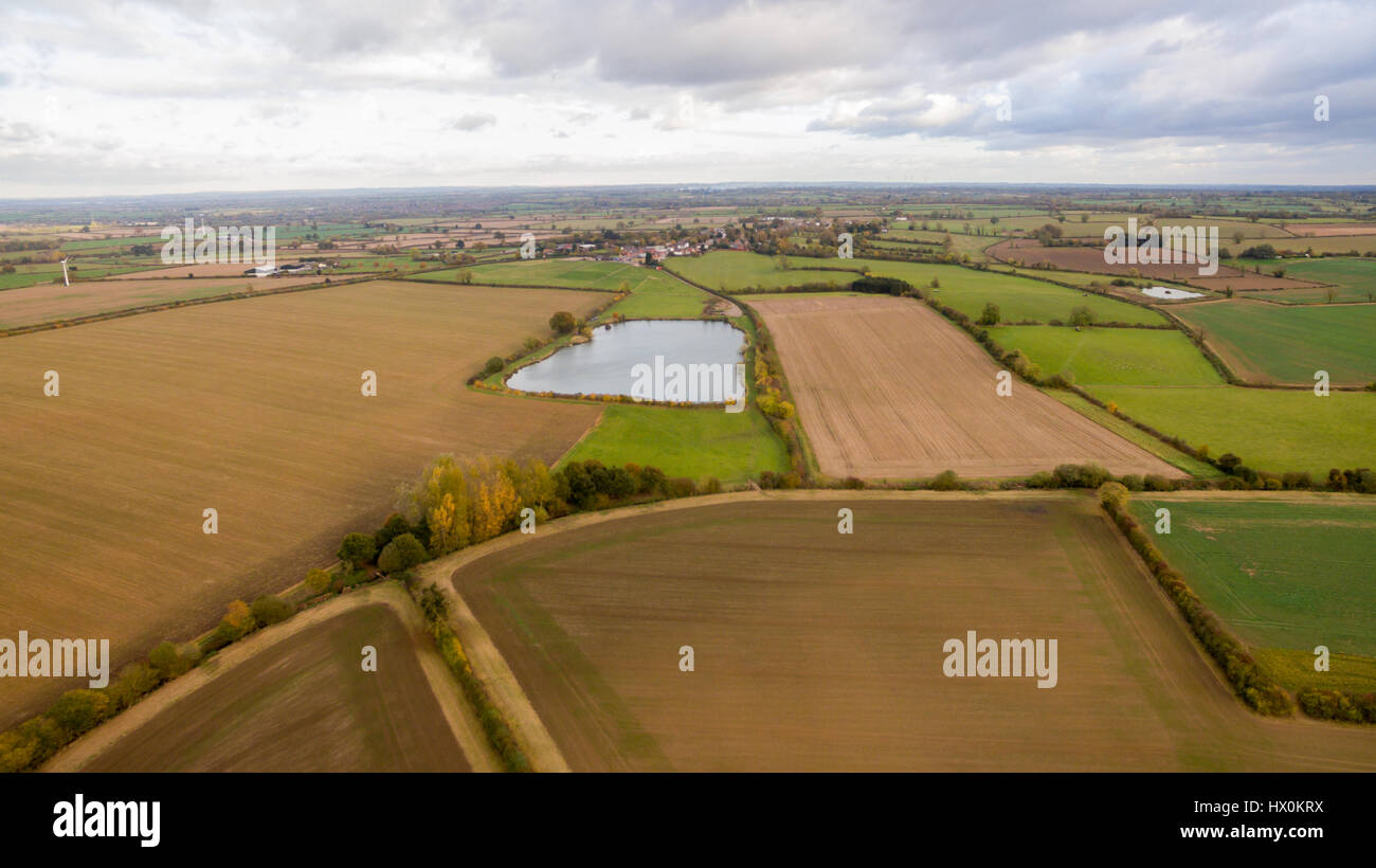 Aerial view from a drone of a lake in the distance in the summertime ...