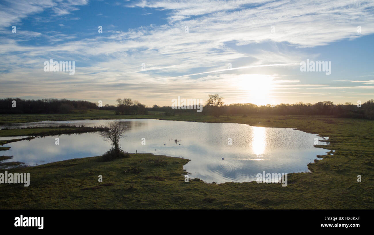 Aerial view over a lake in the winter, with reflections, UK Stock Photo ...