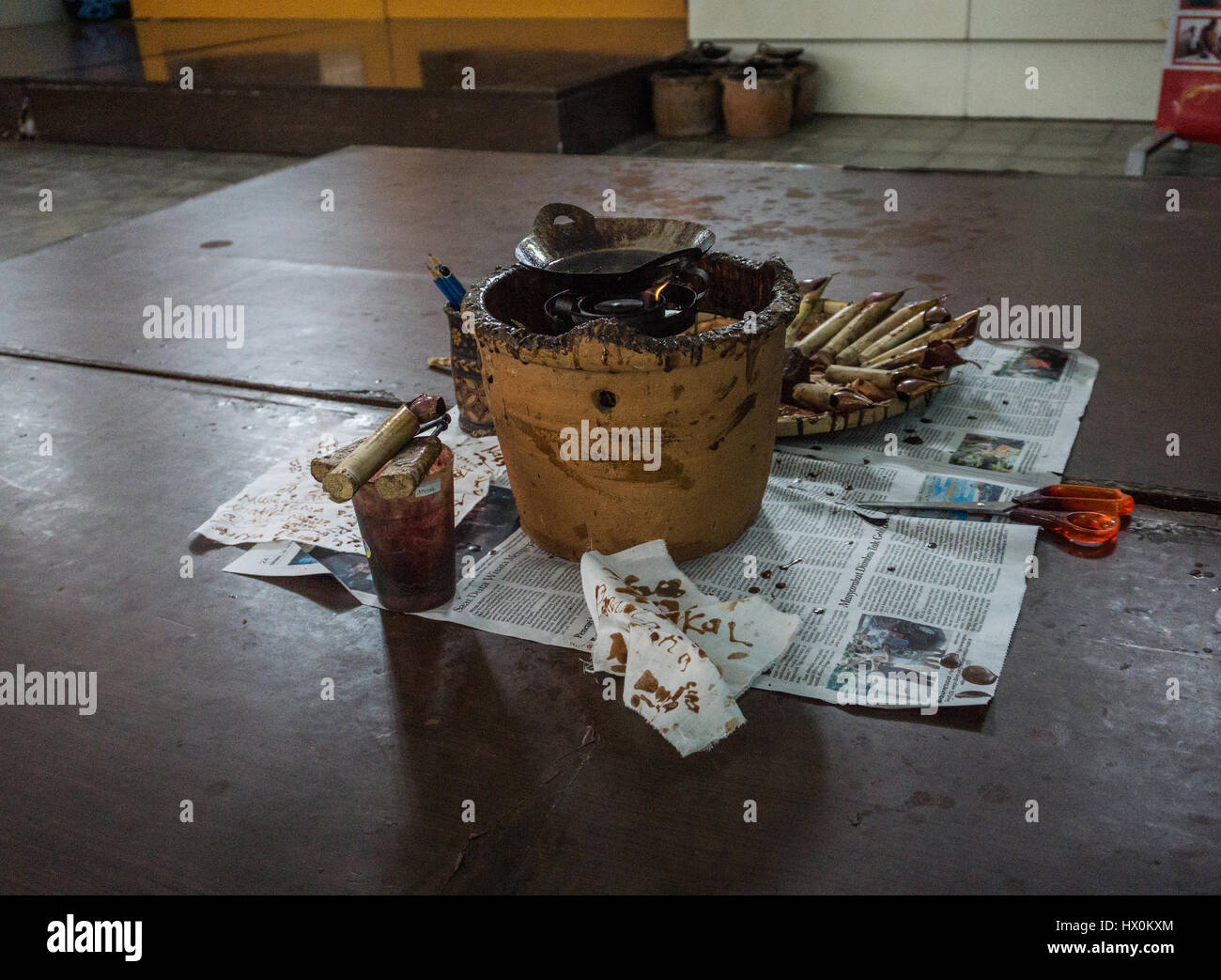 Canting and hot wax on top of wood table for Batik processing photo ...