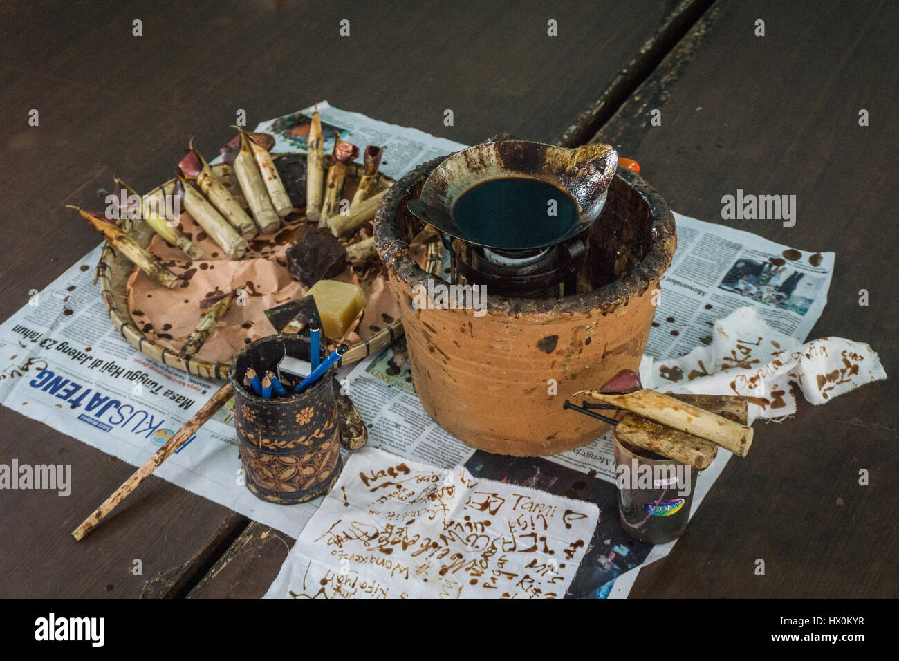 Batik tools, Canting and hot wax on top of wood table for Batik ...