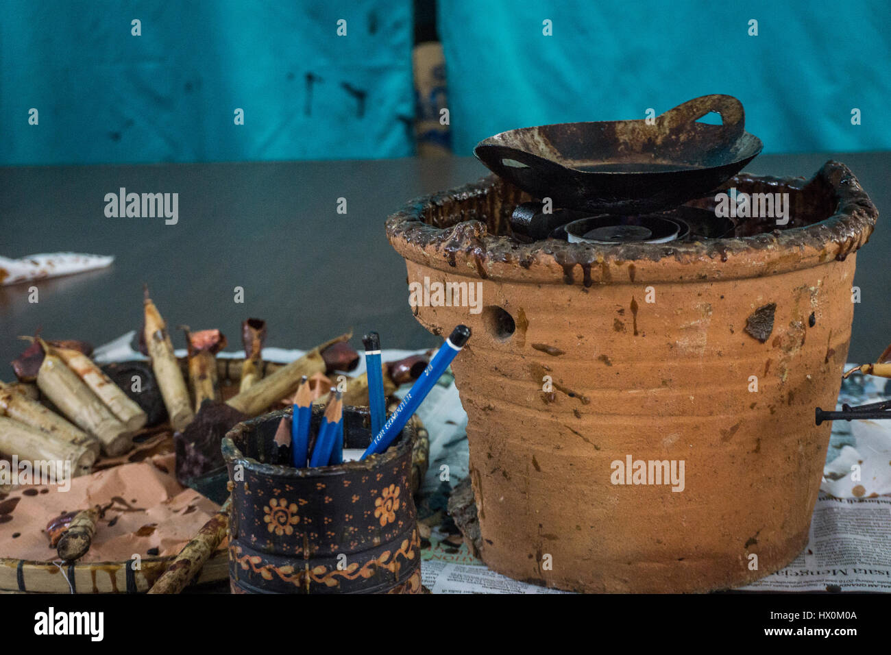 Batik tools, Canting and hot wax on top of wood table for Batik ...