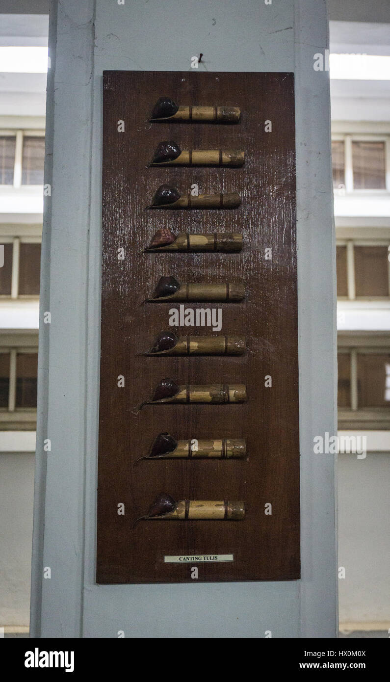 canting made from bamboo for drawing Batik pattern displayed on wood ...