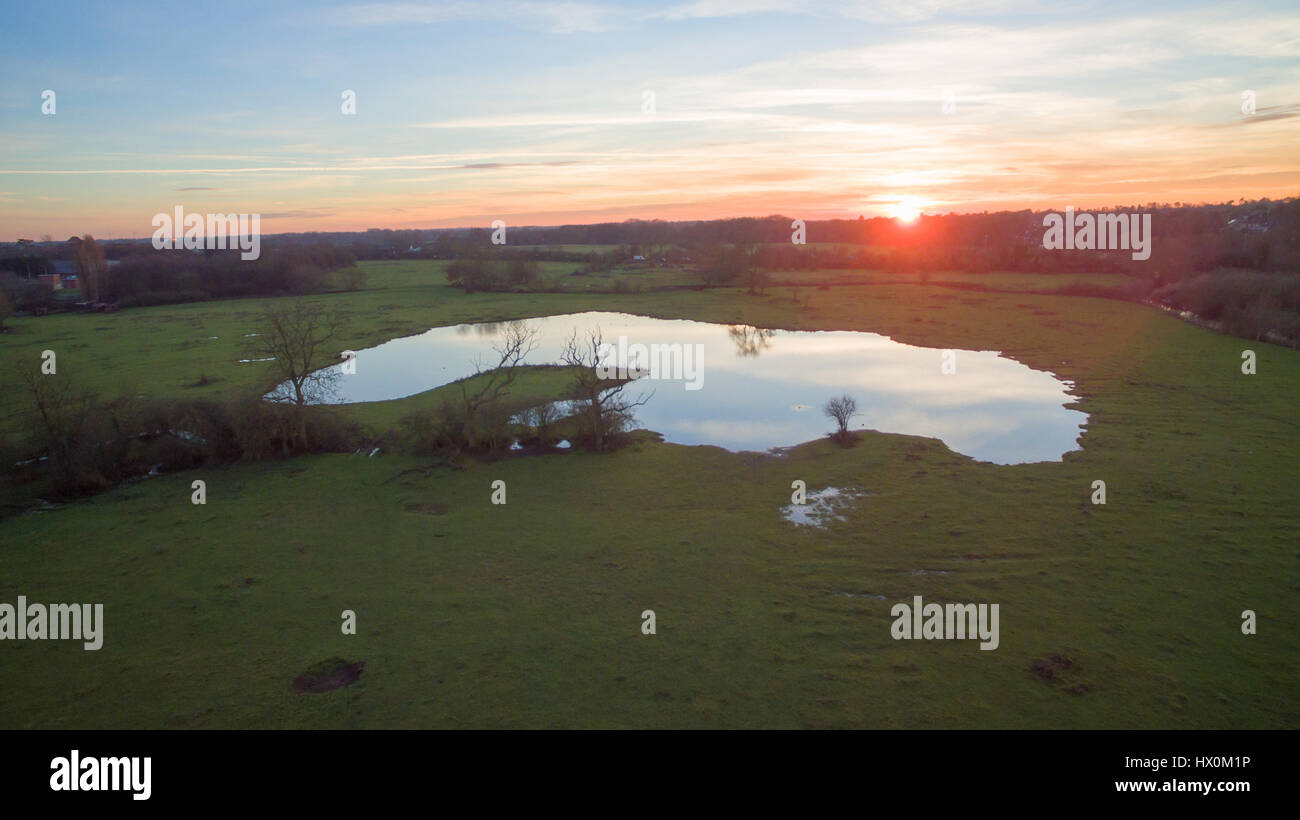 Aerial view over a lake in the winter, with reflections, UK Stock Photo ...