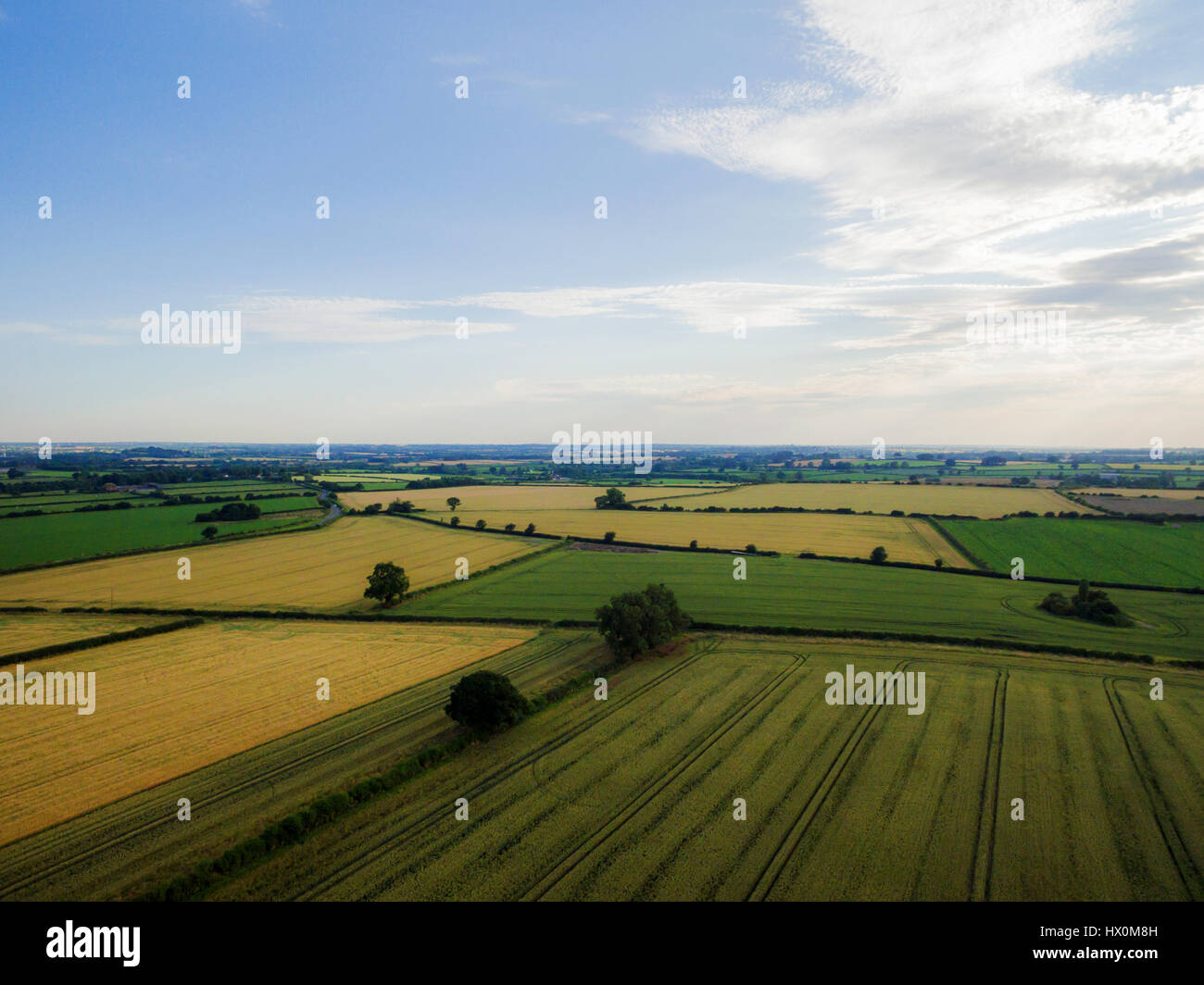 Aerial view over fields near to windmills in the summertime in middle ...