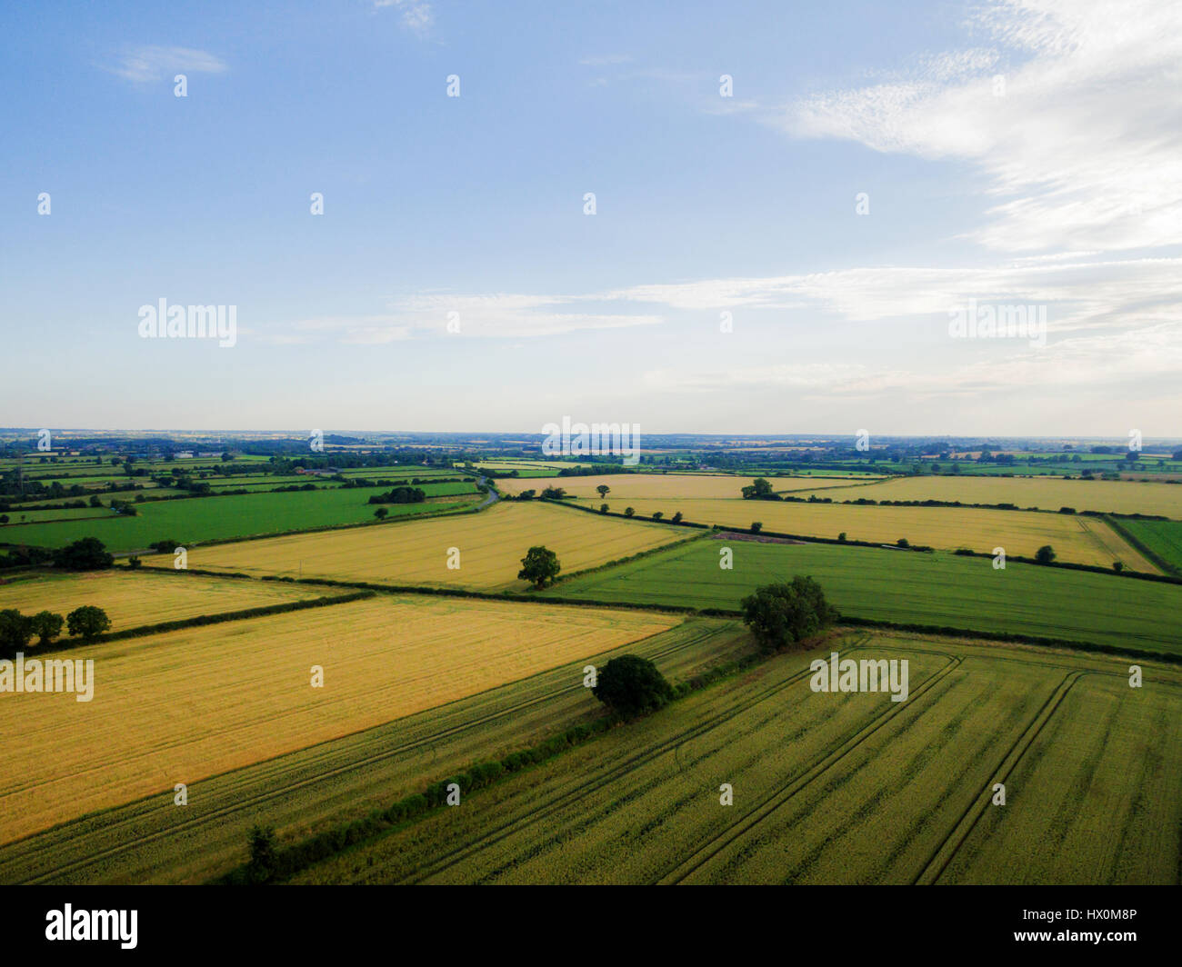 Aerial view over fields near to windmills in the summertime in middle ...