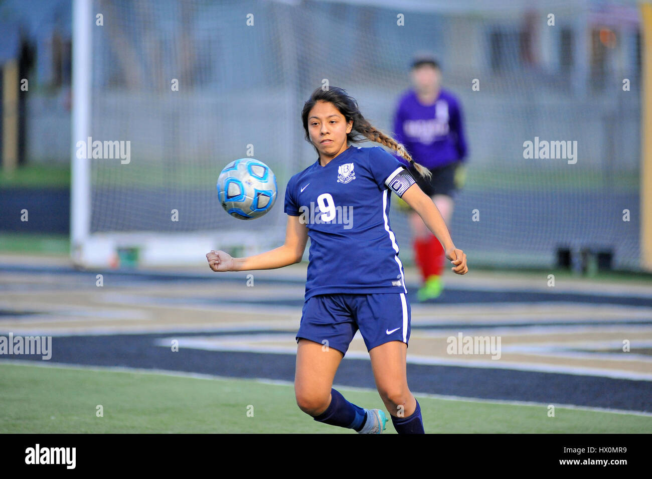 Defender playing a ball of her body deep in her end of the pitch. USA ...