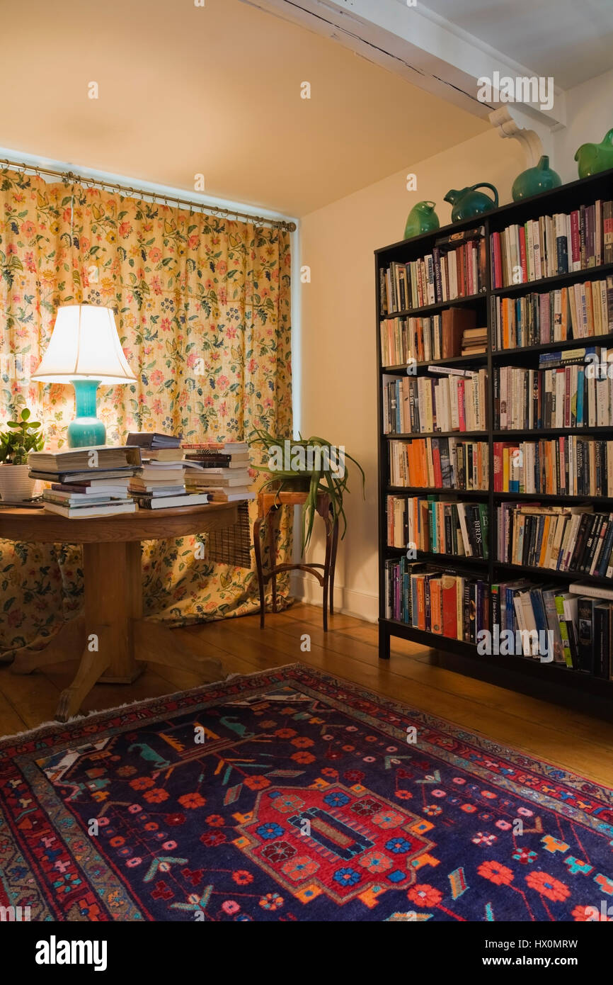 White library room with bookcase and books on round table in 1859 ...