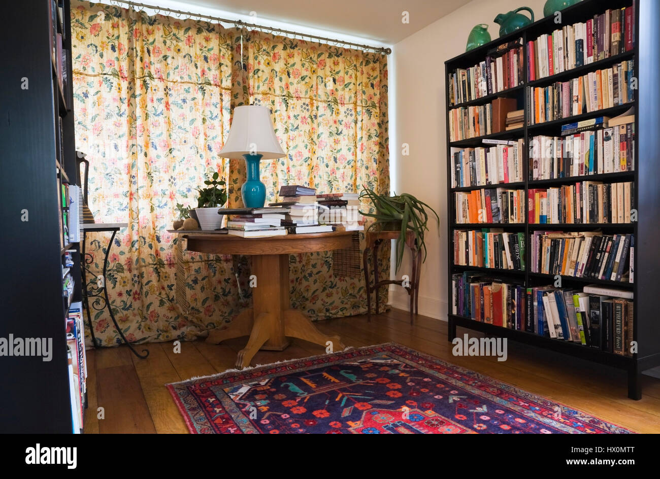 White library room with bookcase and books on round table in 1859 ...