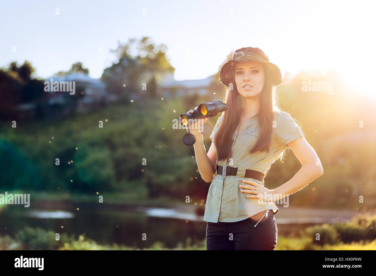 Explorer Girl with Camouflage Hat and Binoculars Stock Photo - Alamy