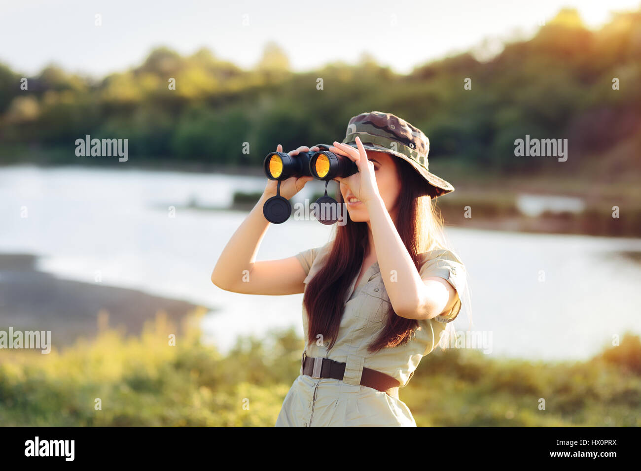Explorer Girl with Camouflage Hat and Binoculars Stock Photo - Alamy