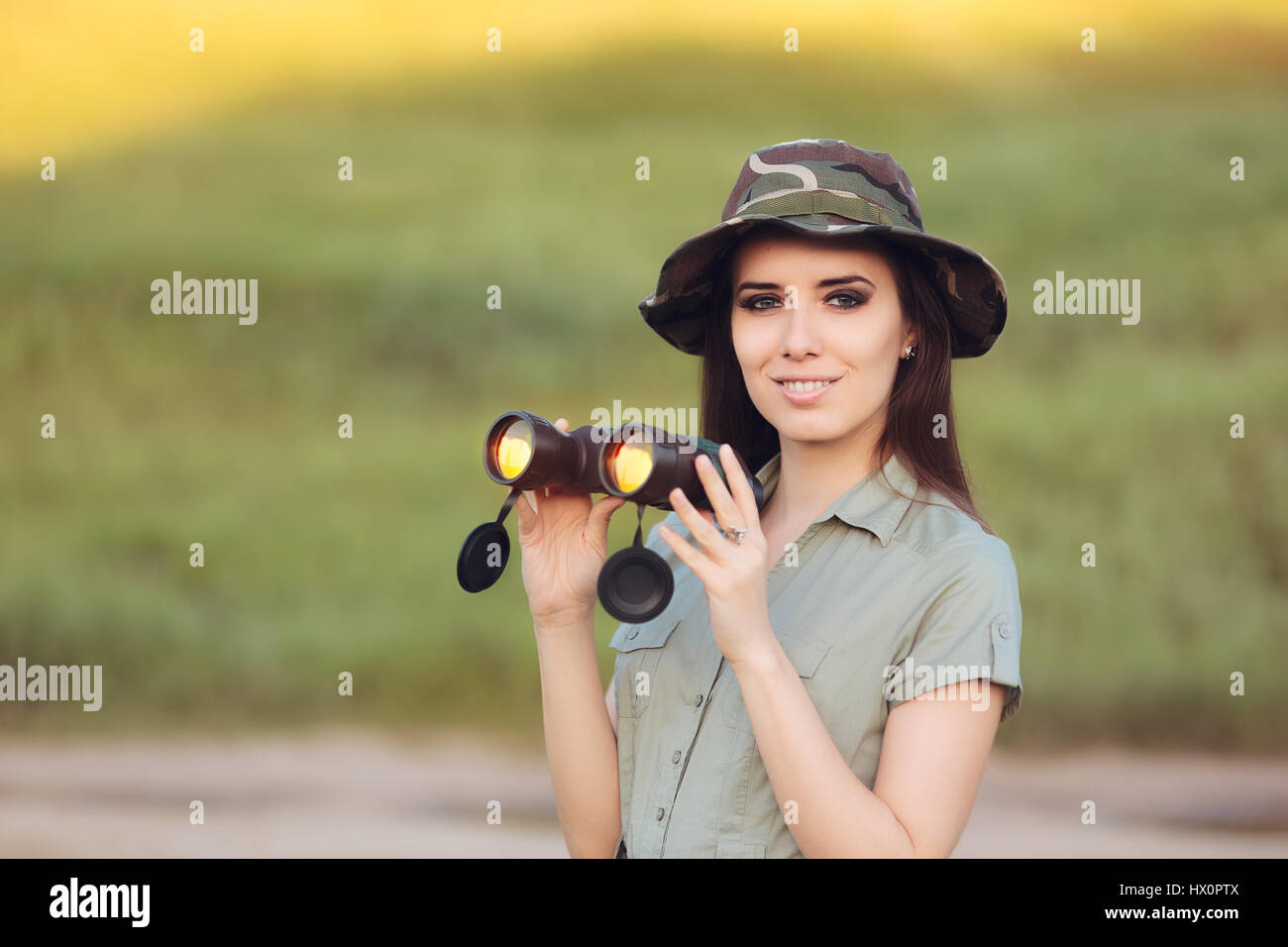 Explorer Girl with Camouflage Hat and Binoculars Stock Photo - Alamy