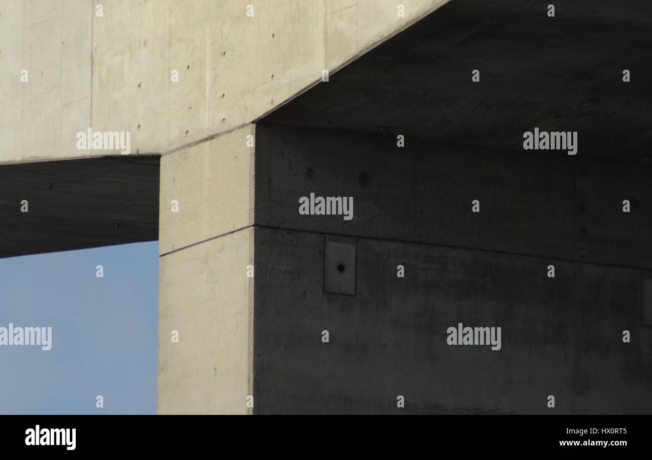 The closeup on the shapes of a concrete bridge makes up an abstract ...