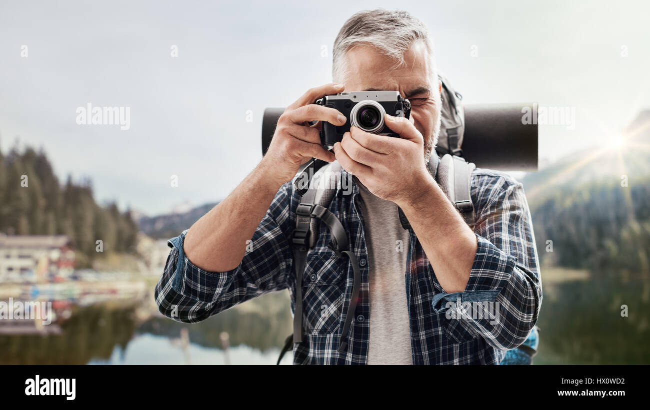 Photographer and explorer trekking on the mountains and exploring ...