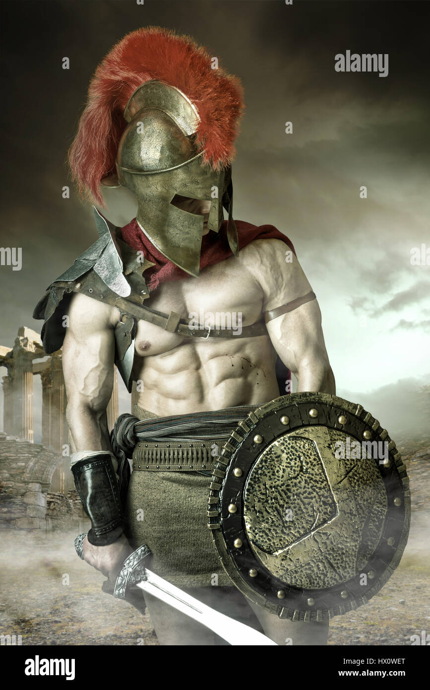 Ancient warrior or Gladiator posing outdoors with helmet Stock Photo ...