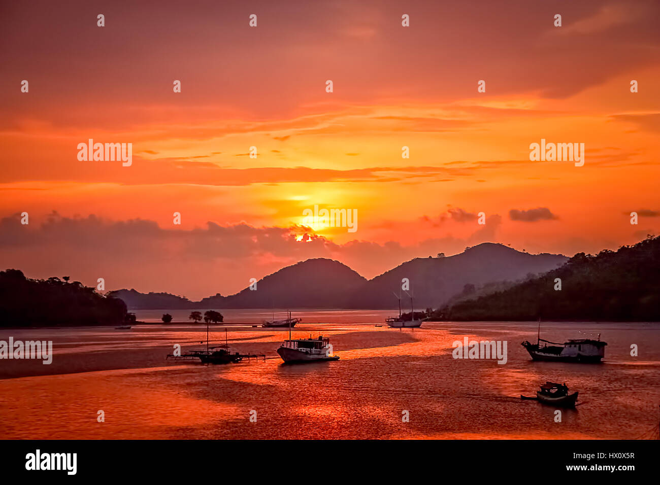 Sunset over bay in Labuhan Bajo town on the Flores island, Indonesia ...