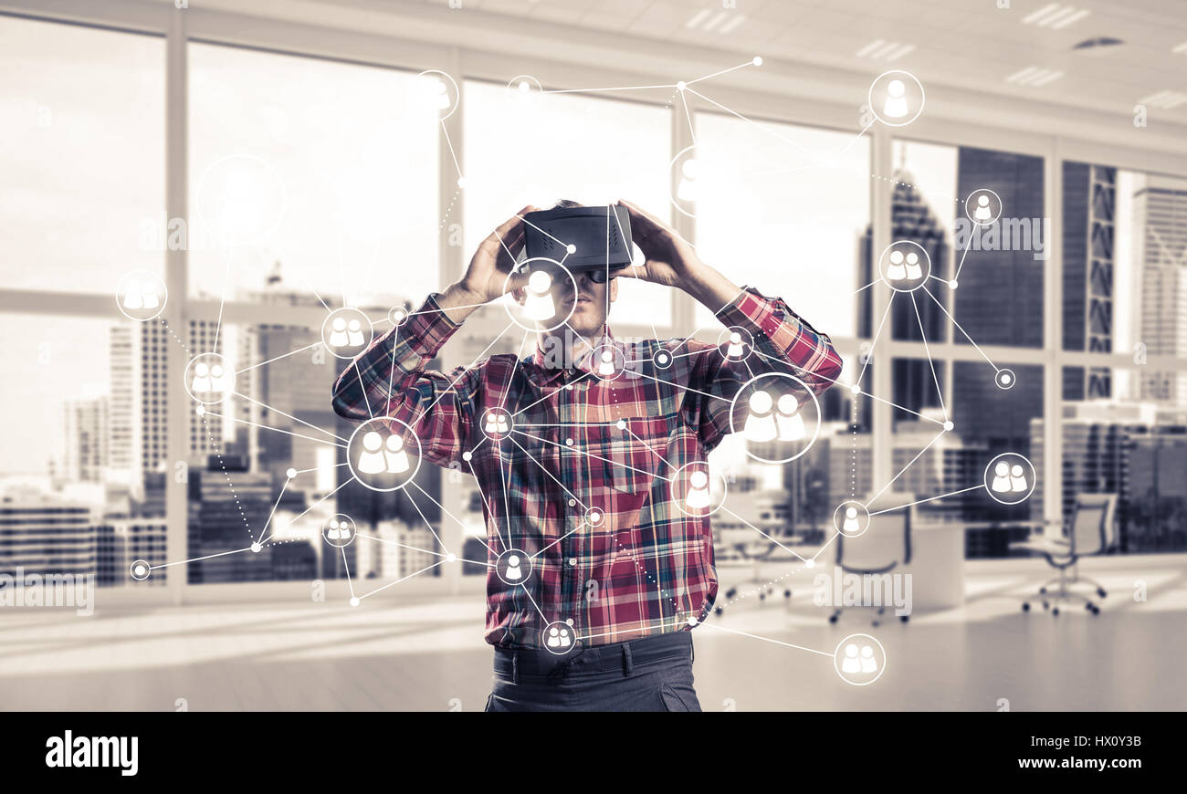 Guy wearing checked shirt and virtual mask demonstrating some em Stock ...