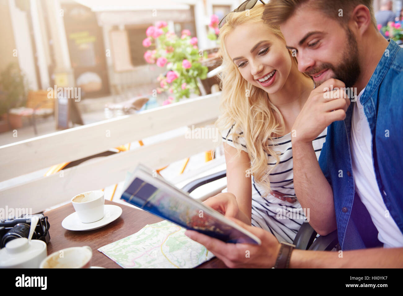Checking some information in the guidebook Stock Photo - Alamy