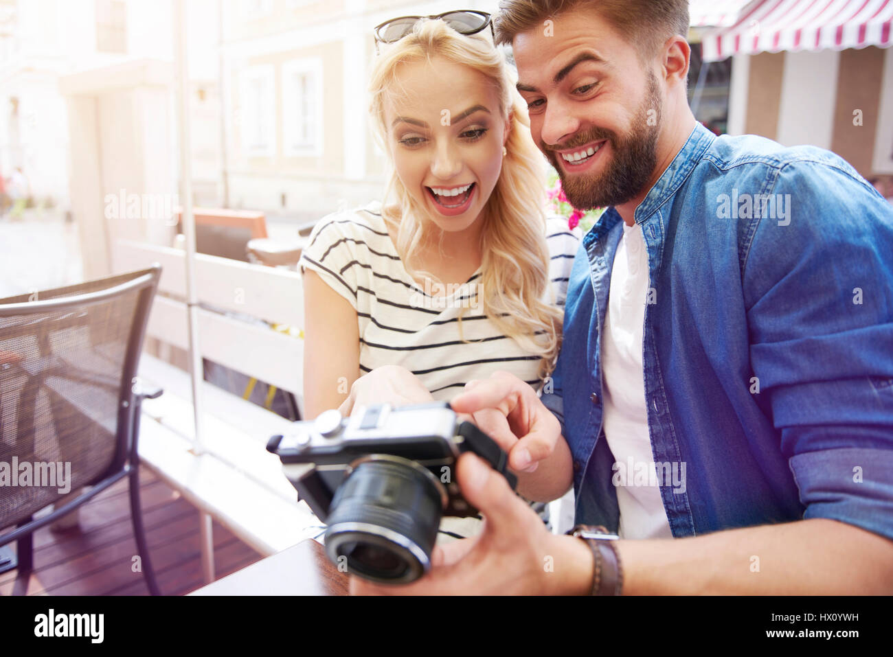 Browsing funny photos on the camera Stock Photo - Alamy