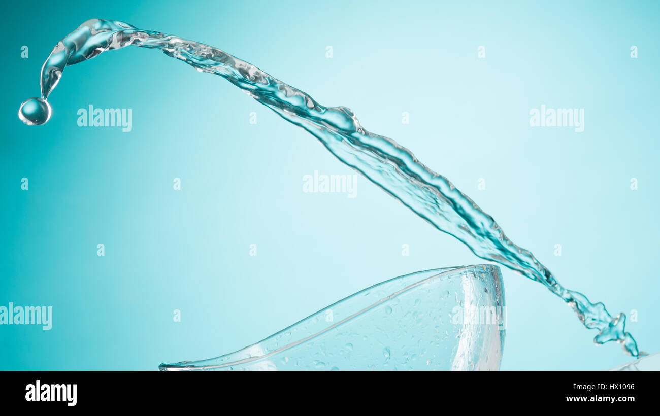 The water splashing to glass bowl on white background Stock Photo - Alamy