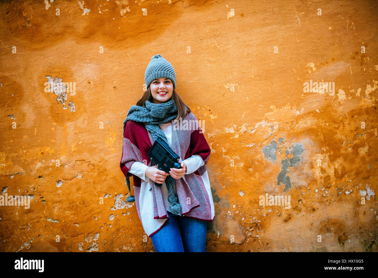 Young woman holding video camera Stock Photo - Alamy