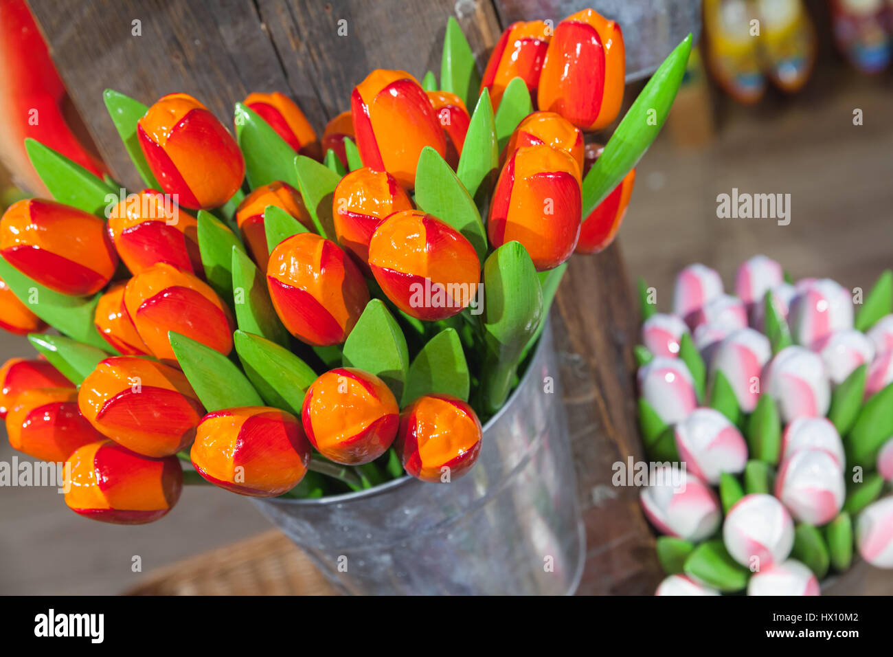 Colorful wooden tulips stand in small bucket in souvenir shop of ...