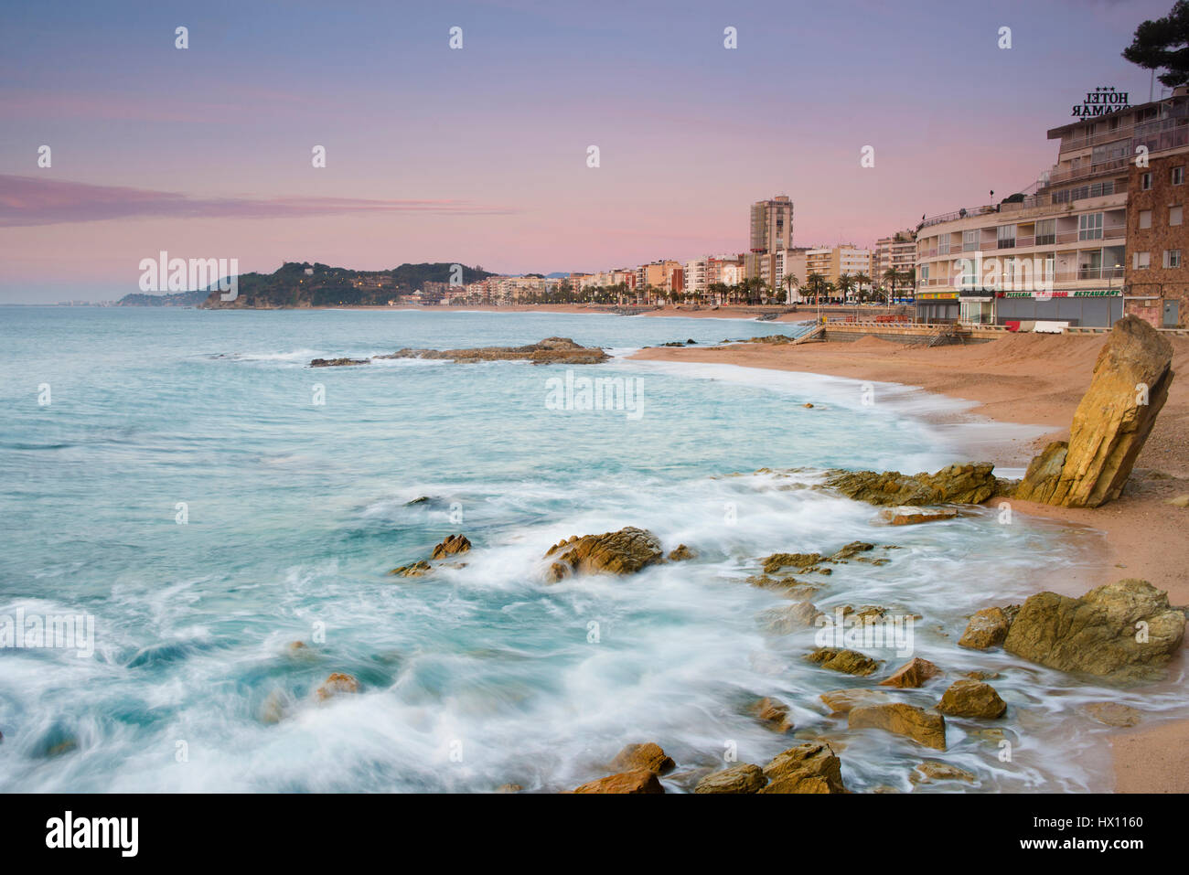Spain, Costa Brava, Lloret de Mar, beach at sunrise Stock Photo - Alamy