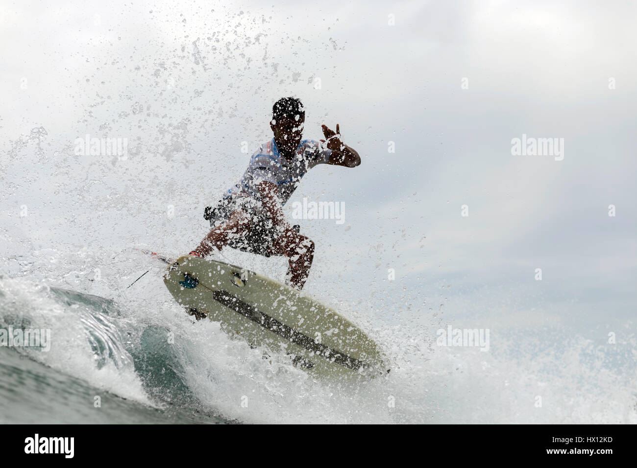 Indonesia, Java, man surfing Stock Photo - Alamy