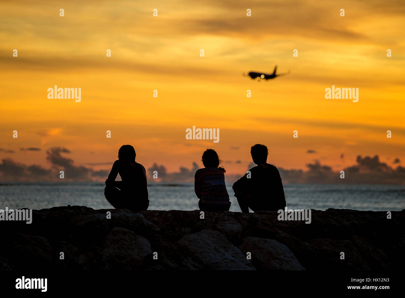 Indonesia, Bali, people watching the sunset over the ocean Stock Photo ...