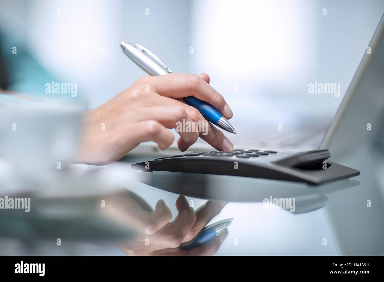 Person using calulator 30 35 years hi-res stock photography and images ...