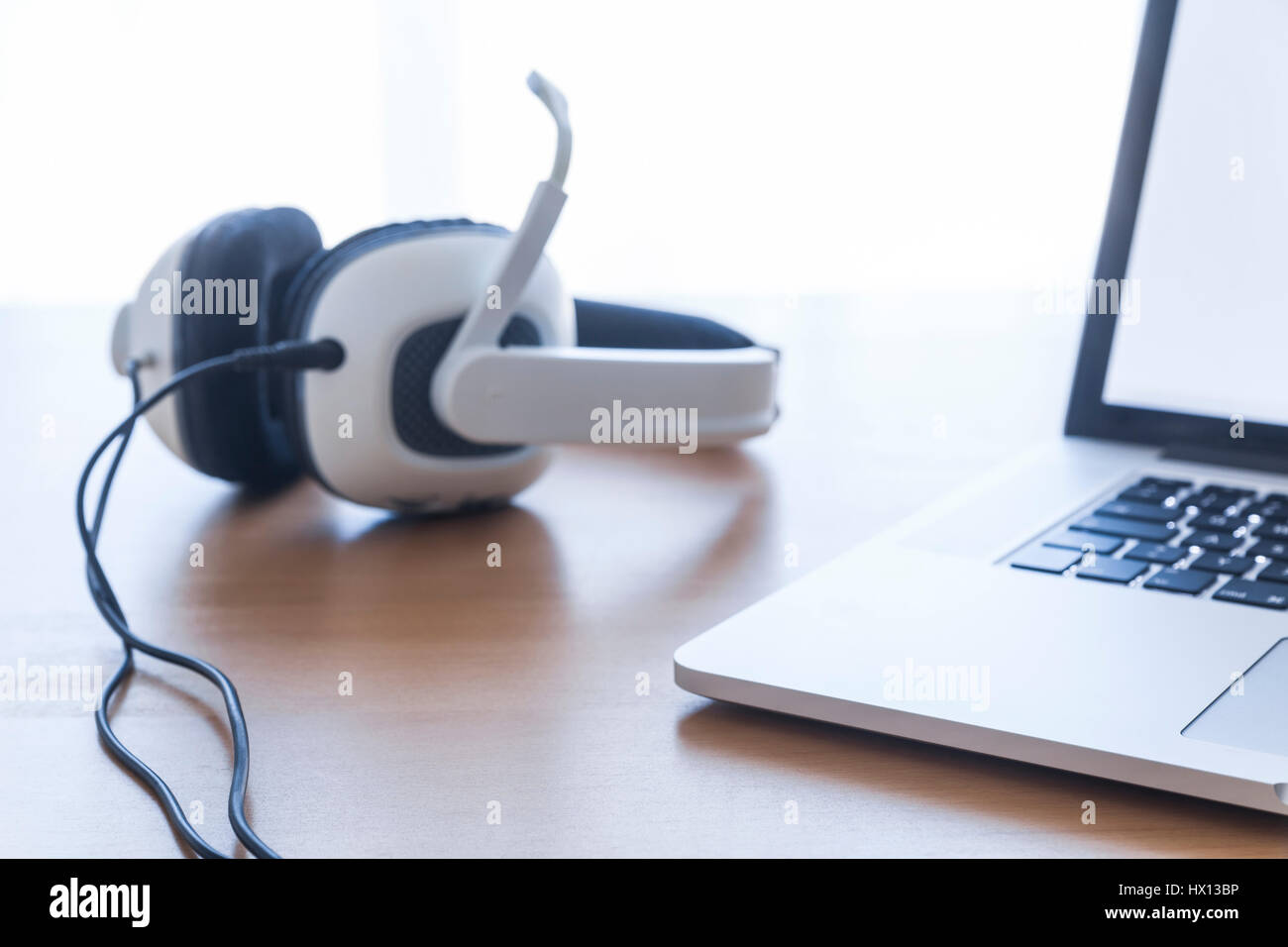 Headset and laptop Stock Photo - Alamy