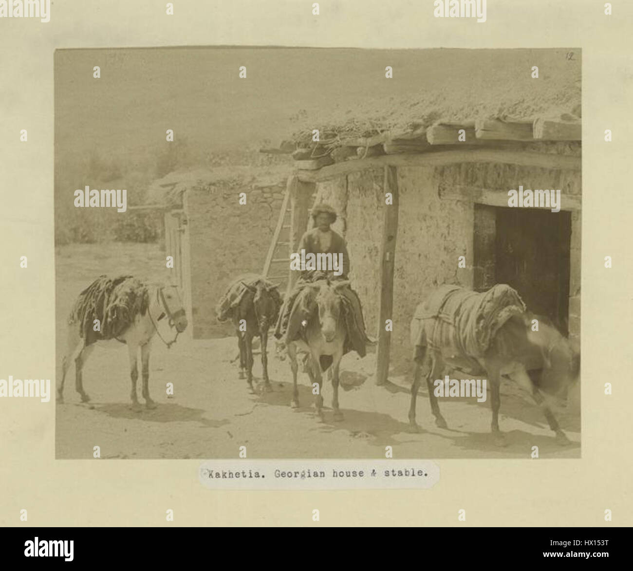 This image depicts a traditional Georgian house and stable in the ...