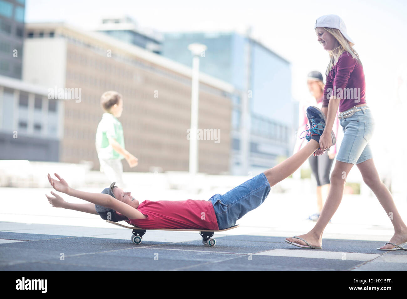 Kids skateboarding in the street Stock Photo - Alamy