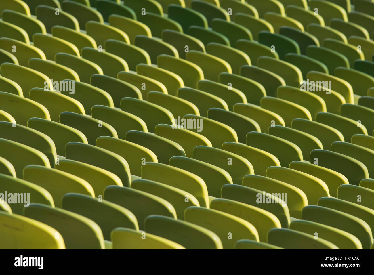 Rows of green seats in a stadium Stock Photo - Alamy