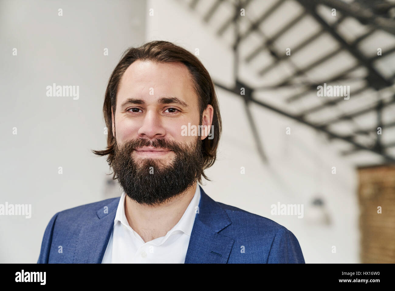 Portrait of smiling businessman Stock Photo - Alamy