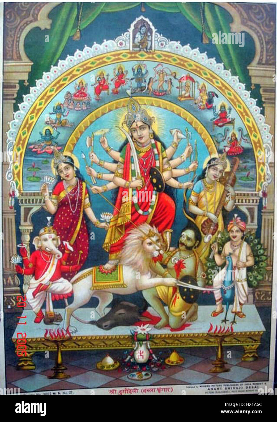 An artwork depicting the Hindu goddess Durga under an arch, surrounded ...
