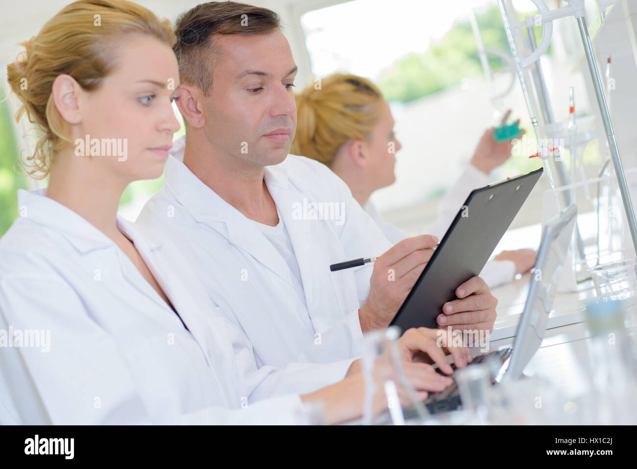 Workers in a laboratory Stock Photo - Alamy